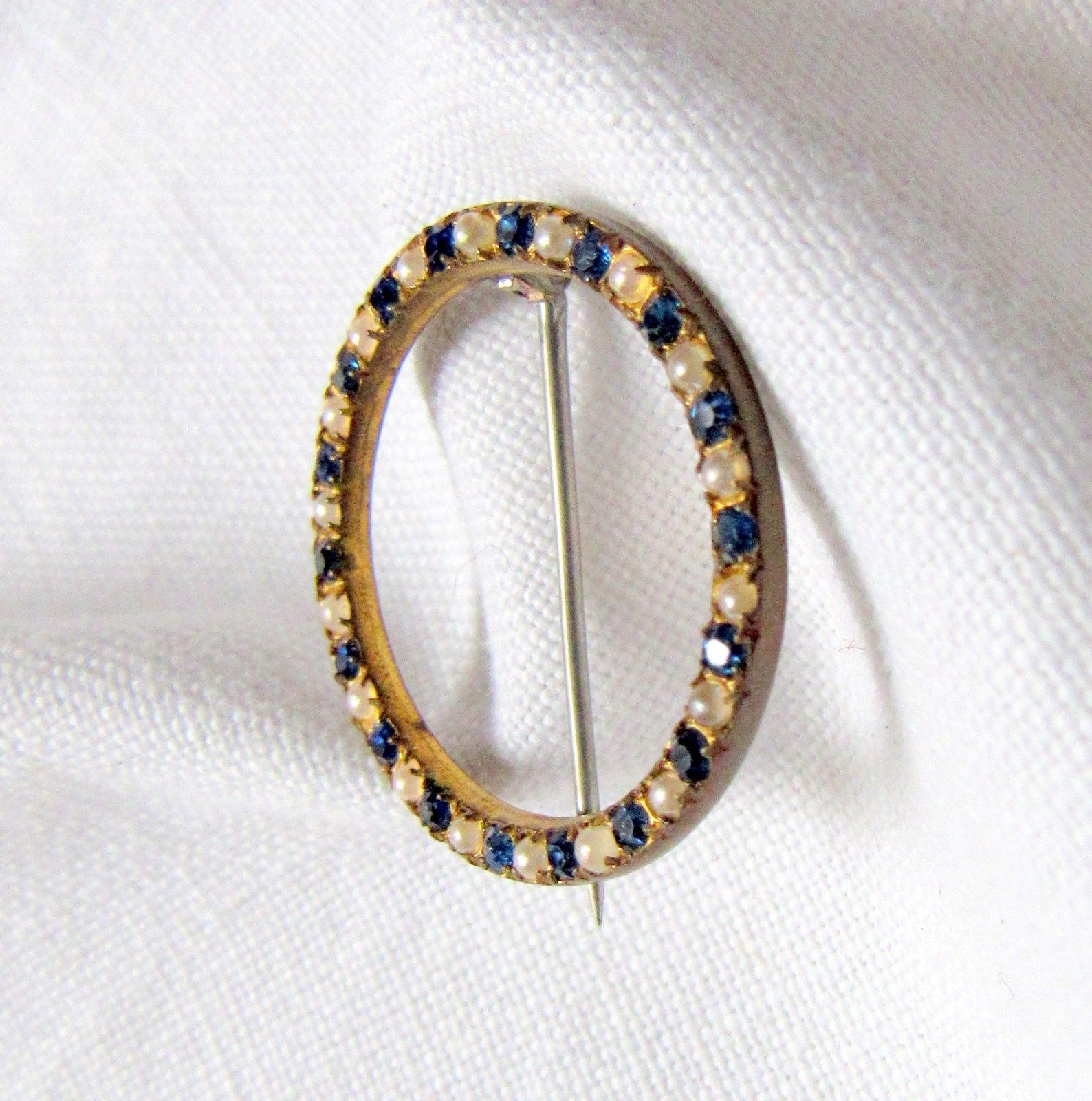 Antique Round Gold Pin with Dazzling Navy Blue Gemstones and Seed ...