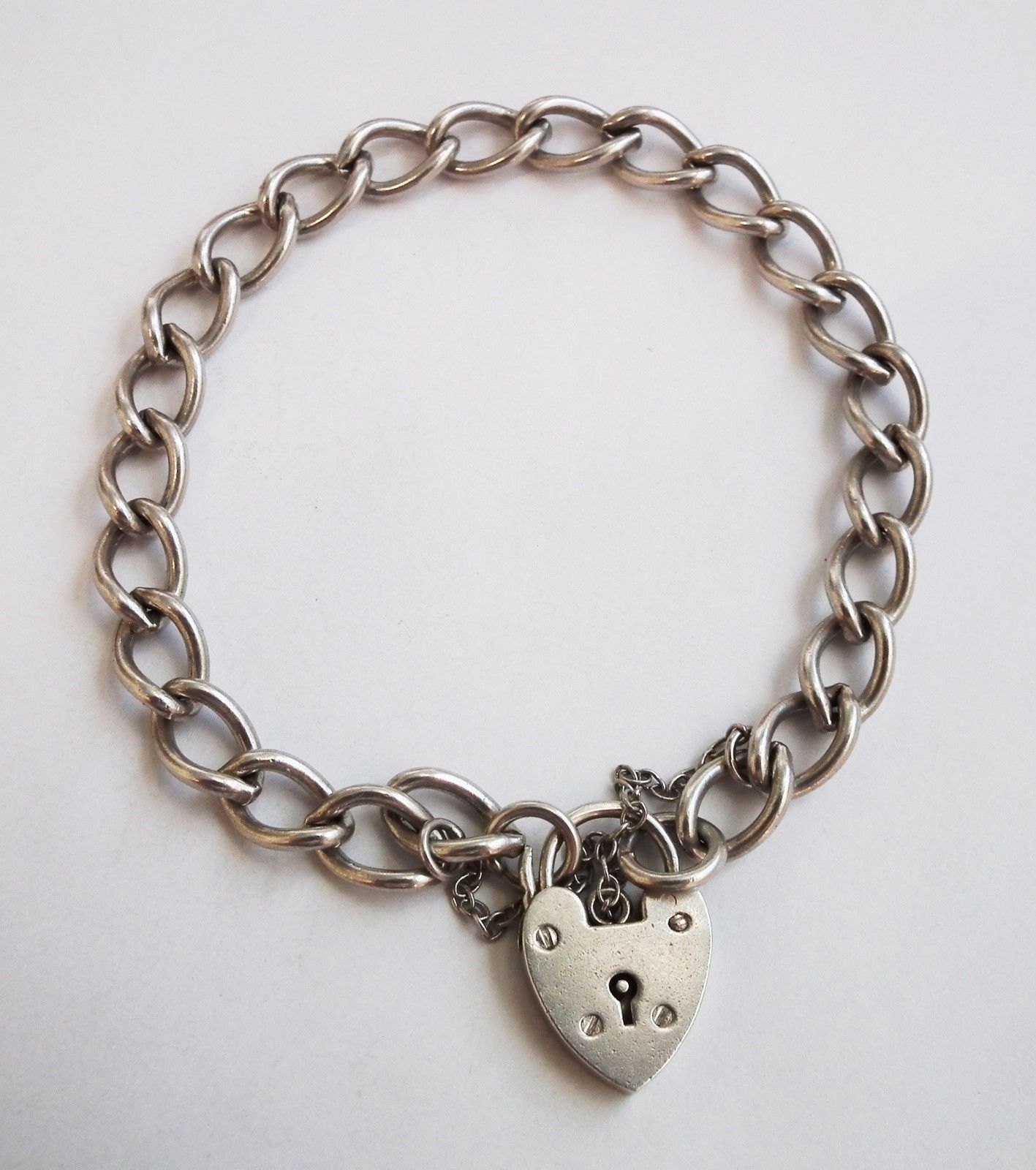 VINTAGE SILVER HEART PADLOCK BRACELET. Curb link. 18cm. 14.6 grams. WJS ...