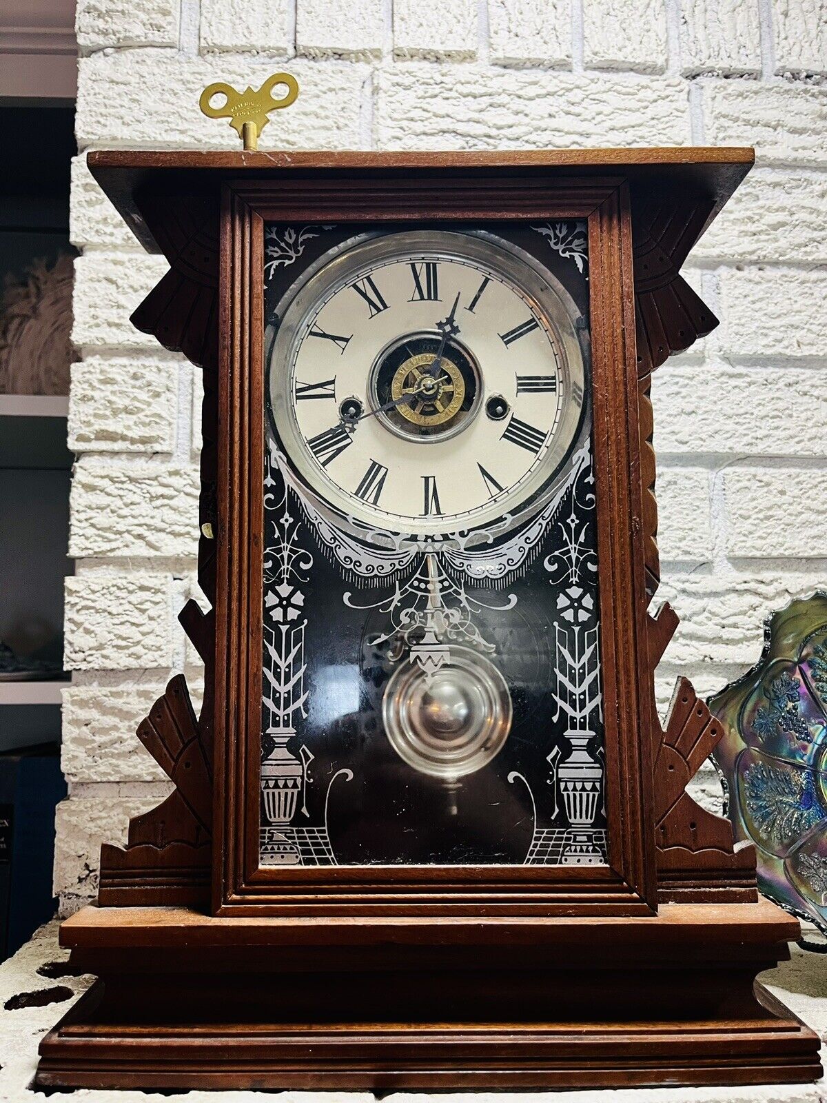 Antique wooden wind up wall mantle clock with pendulum and key. Old and ... Antique wooden wind up wall mantle clock with pendulum and key. Old and ...